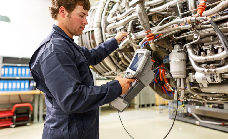 Aviation technician using GE's Mentor Visual IQ during a safety ...